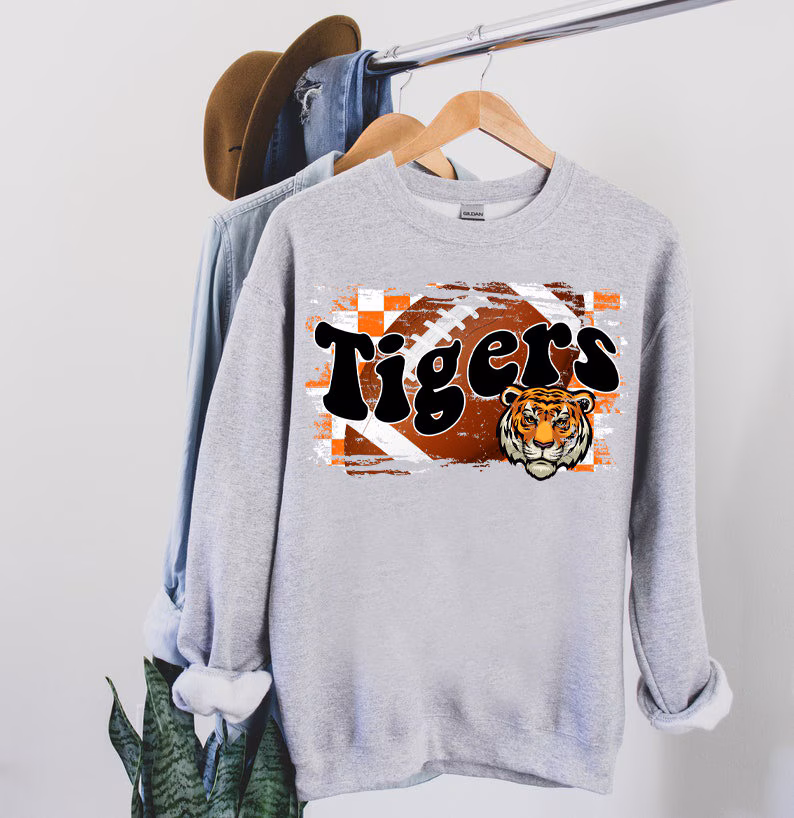 'Tigers' Bold Lettering with Fierce Tiger Head on Grunge Football ...