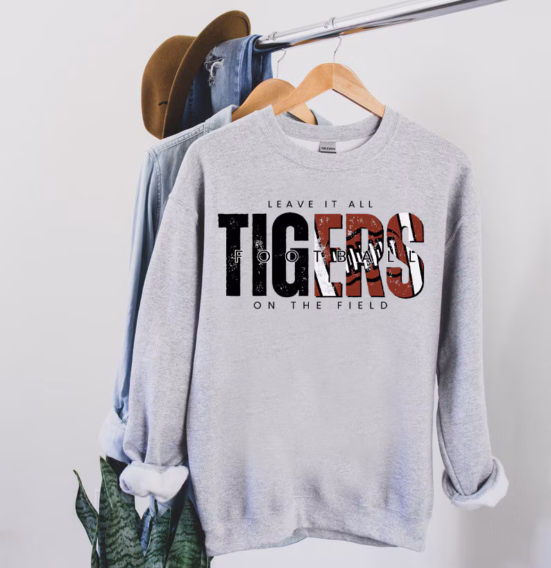 'Tigers' Bold Typography with Fierce Red Claw Marks and Motivational ...
